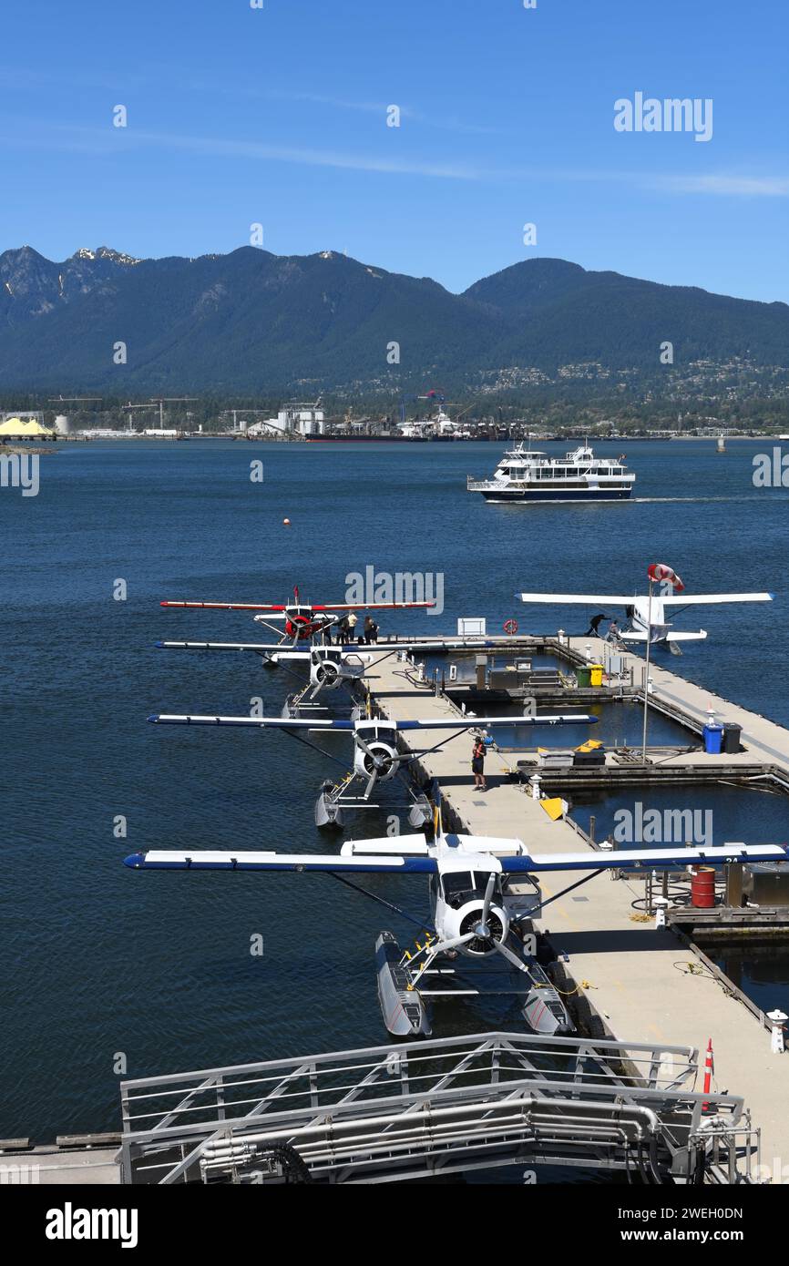 Seaplanes lined up at the pontoon in Vancouver Harbour, BC, Canada ...