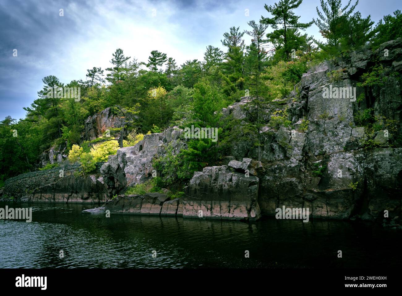 Rock Cliff on the Edge of a River in America Stock Photo - Alamy