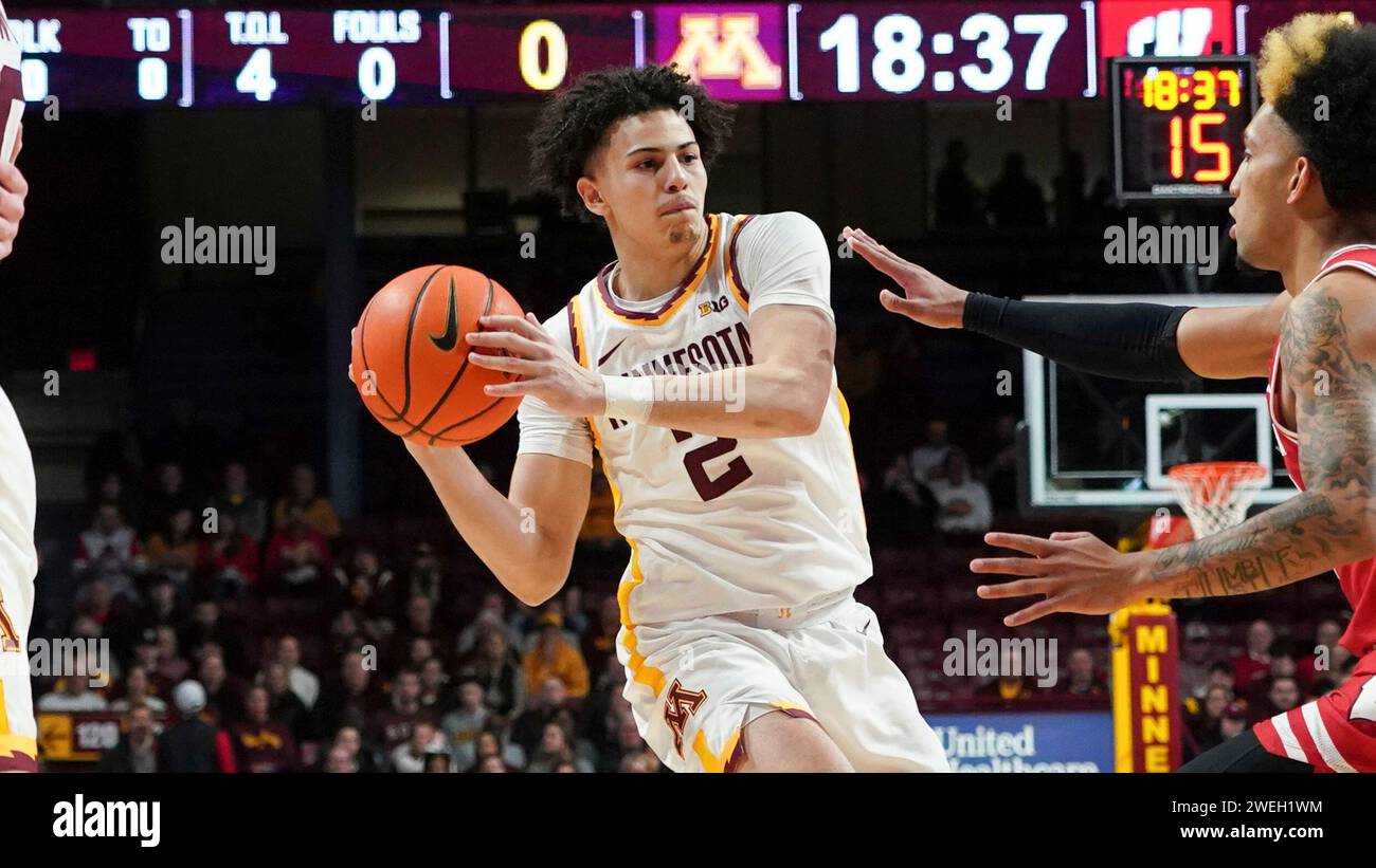 Minnesota guard Mike Mitchell Jr. looks to make a pass in their game ...