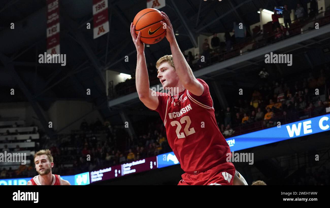 Wisconsin forward Steven Crowl grabs a rebound against Minnesota during ...