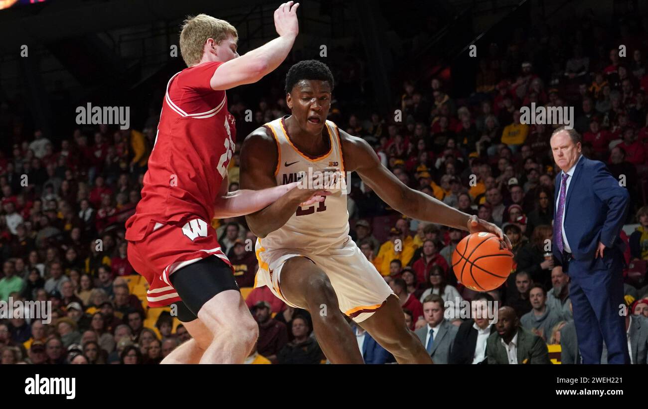 Minnesota forward Pharrel Payne, right, drives past Wisconsin forward ...
