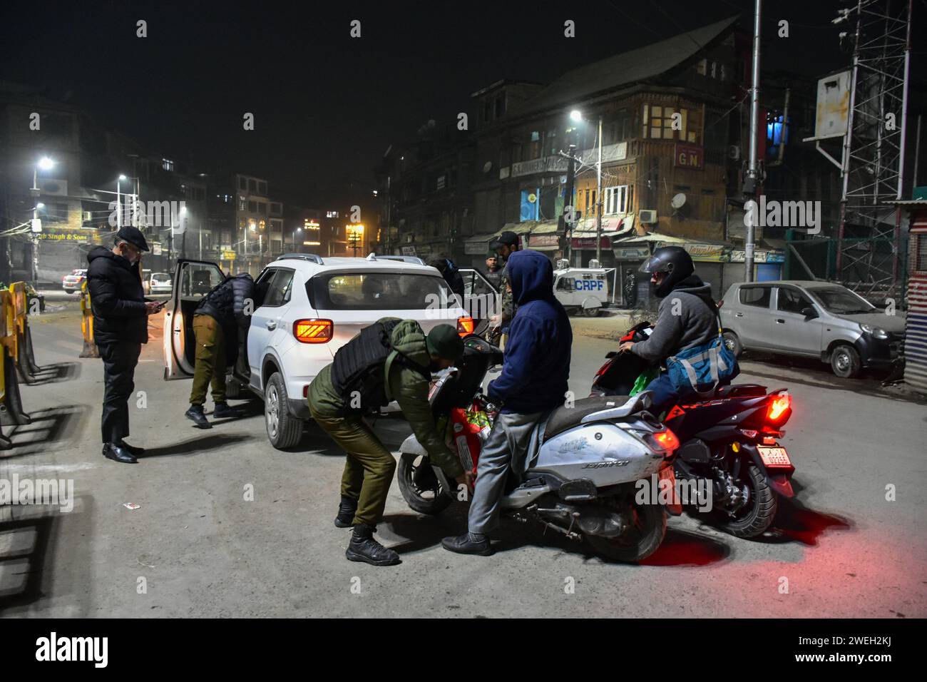 Government forces frisk vehicles near a temporary check-post ahead of ...