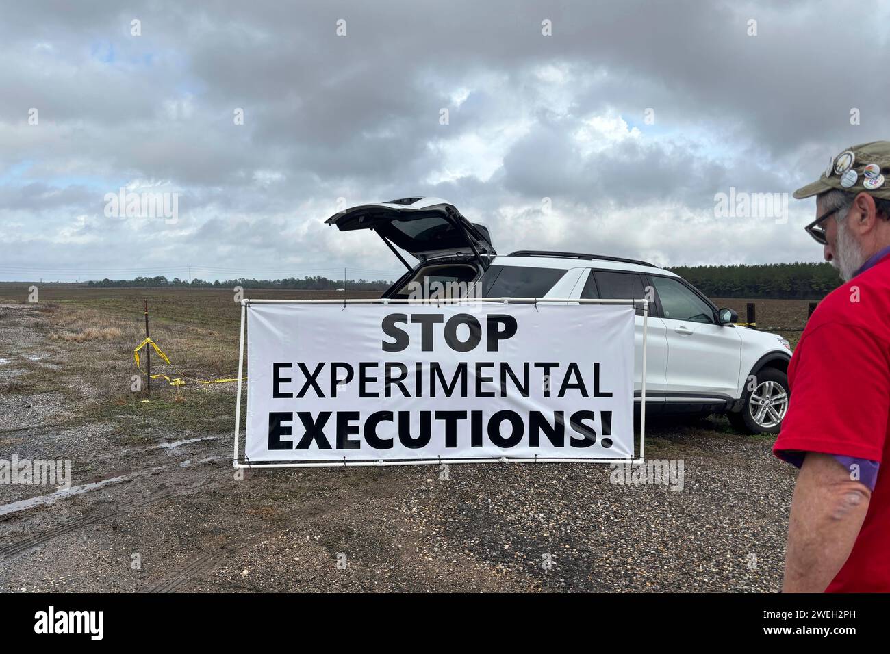 Anti-death penalty activists place signs along the road heading to ...