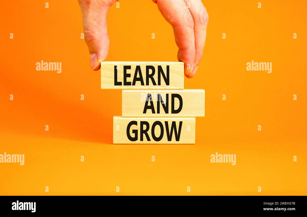 Learn and grow symbol. Concept word Learn And Grow on beautiful wooden ...