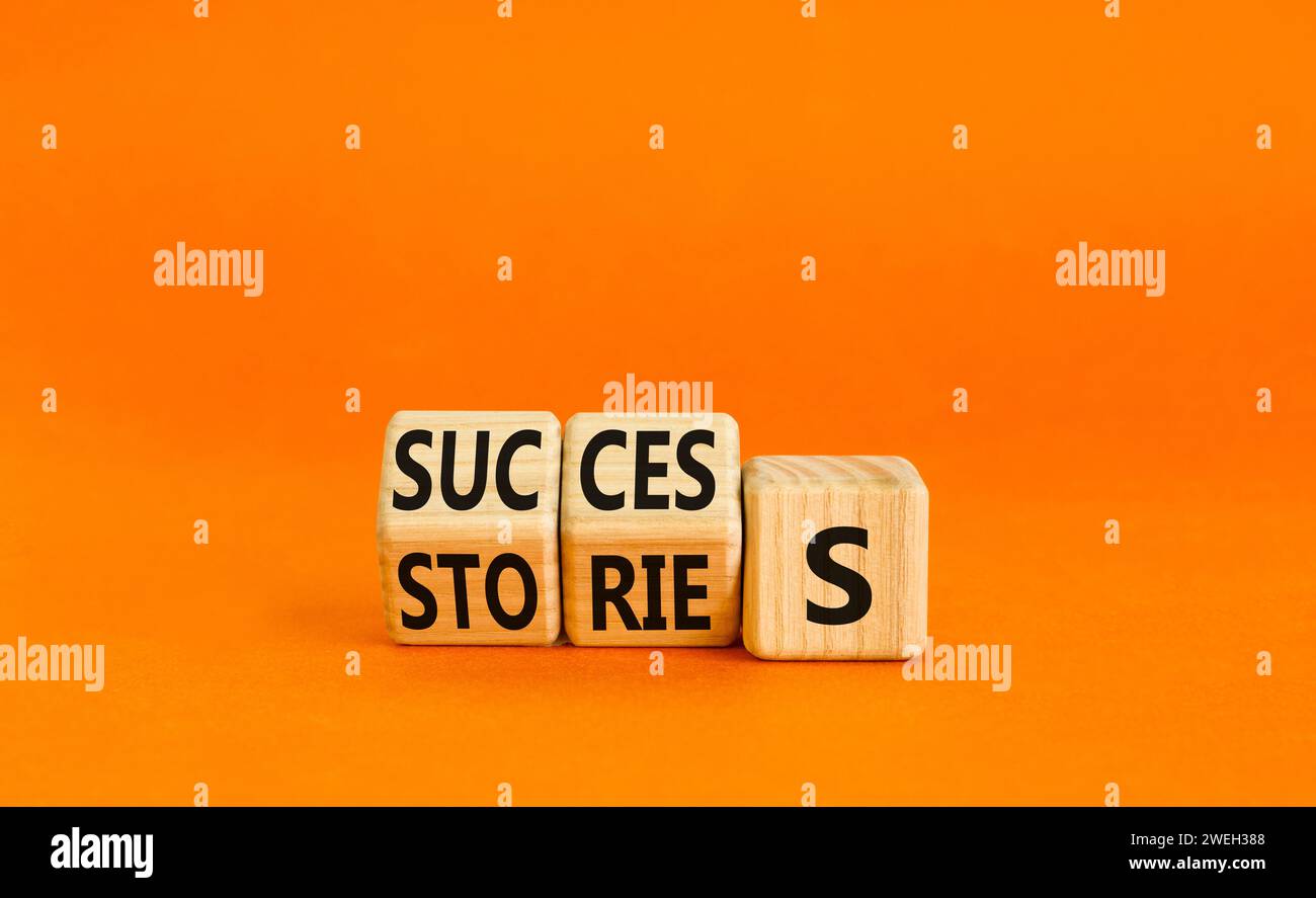 Success stories symbol. Turned wooden cubes and changed the word ...