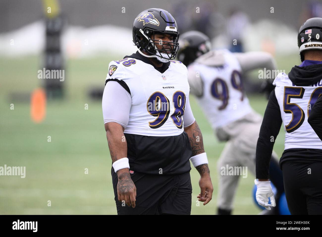 Baltimore Ravens defensive tackle Travis Jones (98) looks on during an ...