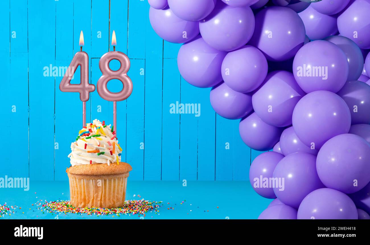 Birthday candle number 48 - Cupcake and balloon decoration Stock Photo ...