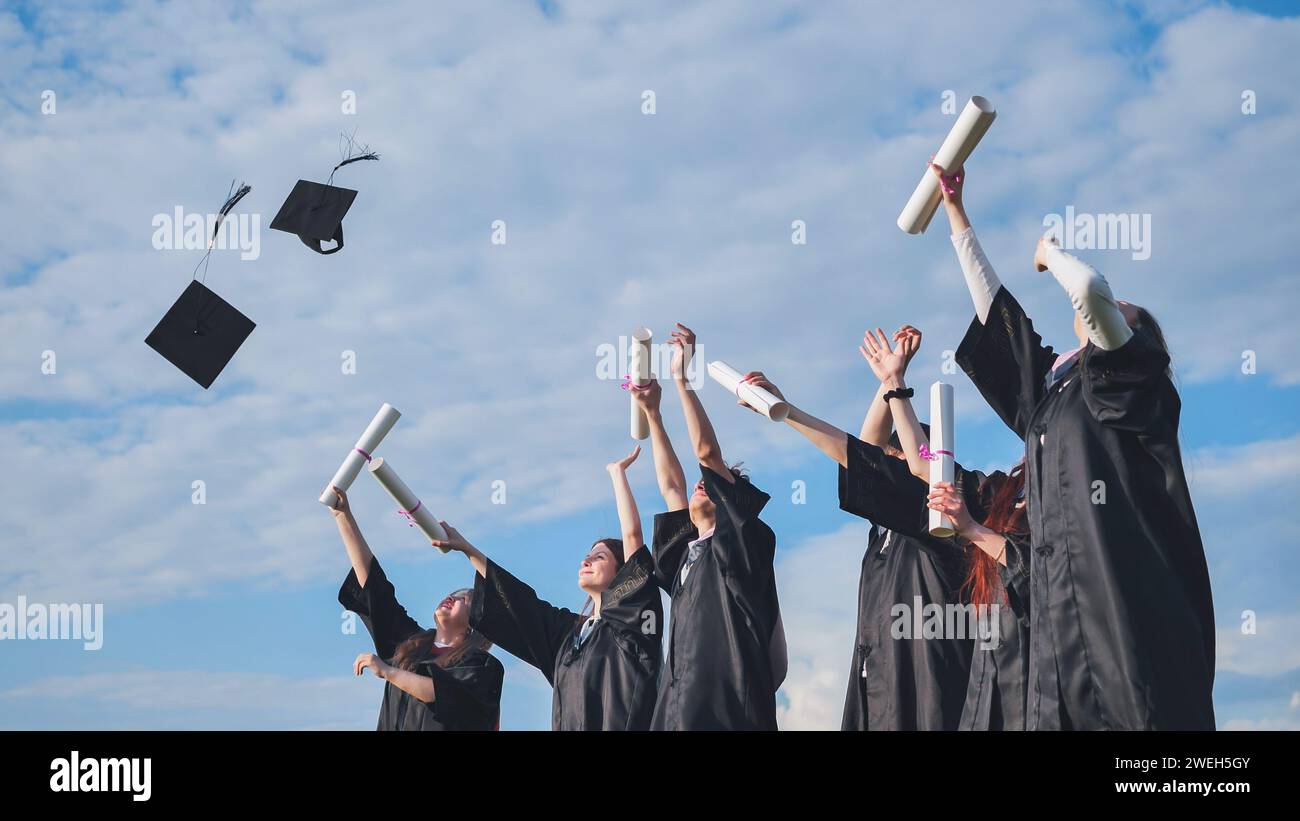 Throwing up grad caps hi-res stock photography and images - Alamy