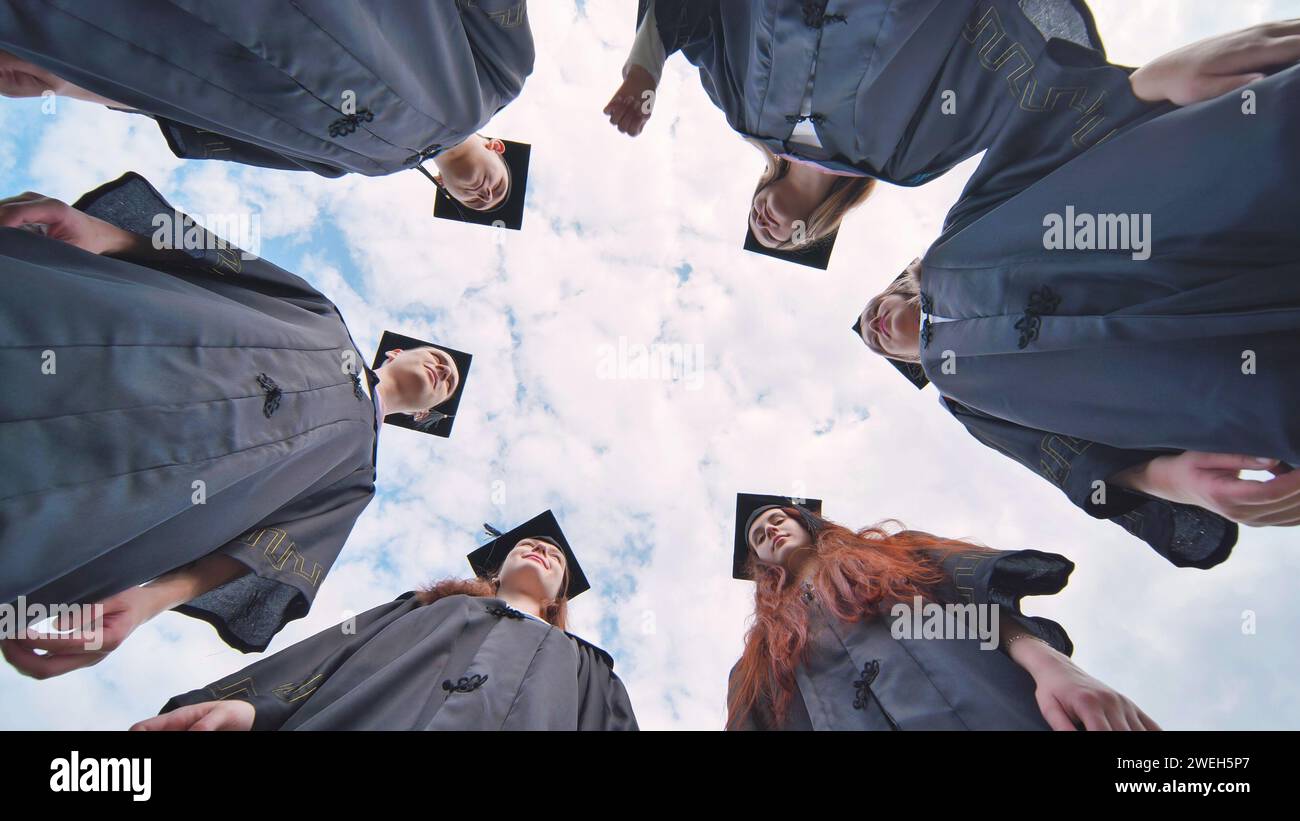 College students stand in a circle wearing black robes Stock Photo - Alamy