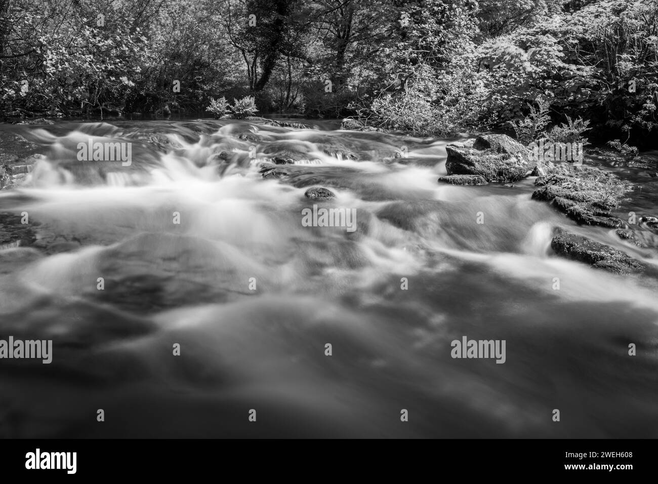 Long exposure of a waterfall on the East Lyn river flowing through the ...