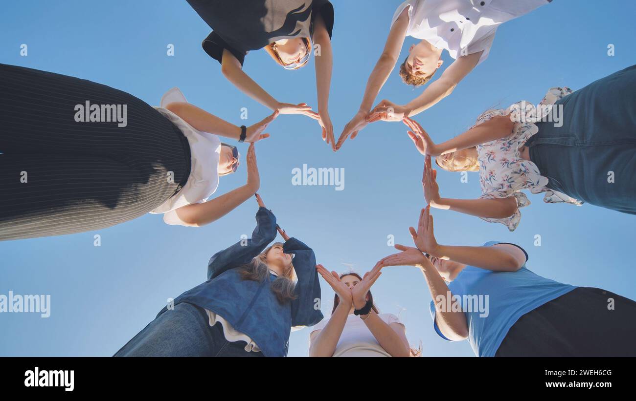 School children make a heart shape from their hands Stock Photo - Alamy