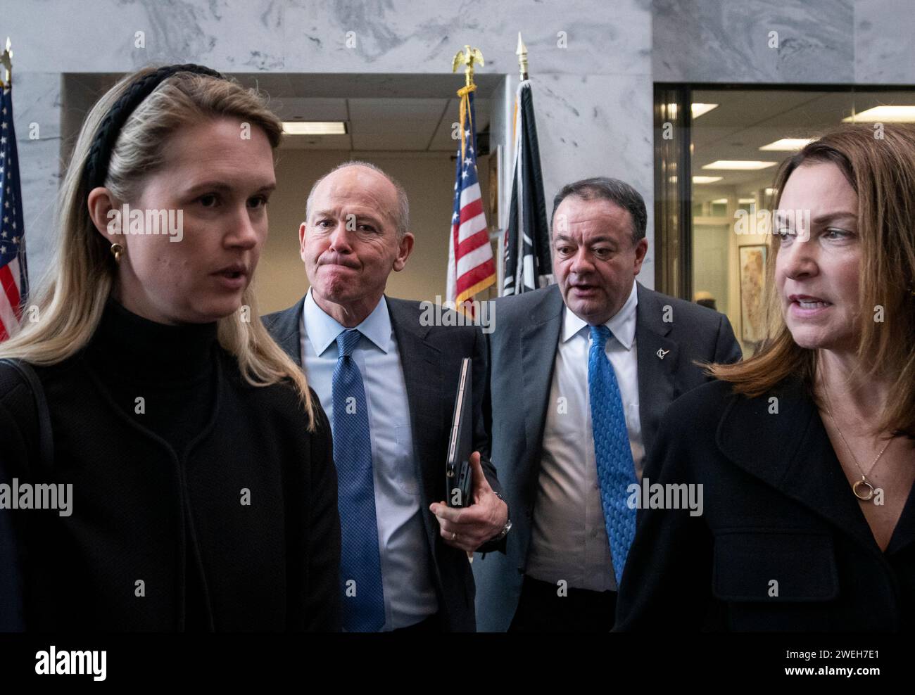 Boeing CEO Dave Calhoun, second from left, departs the office of United ...