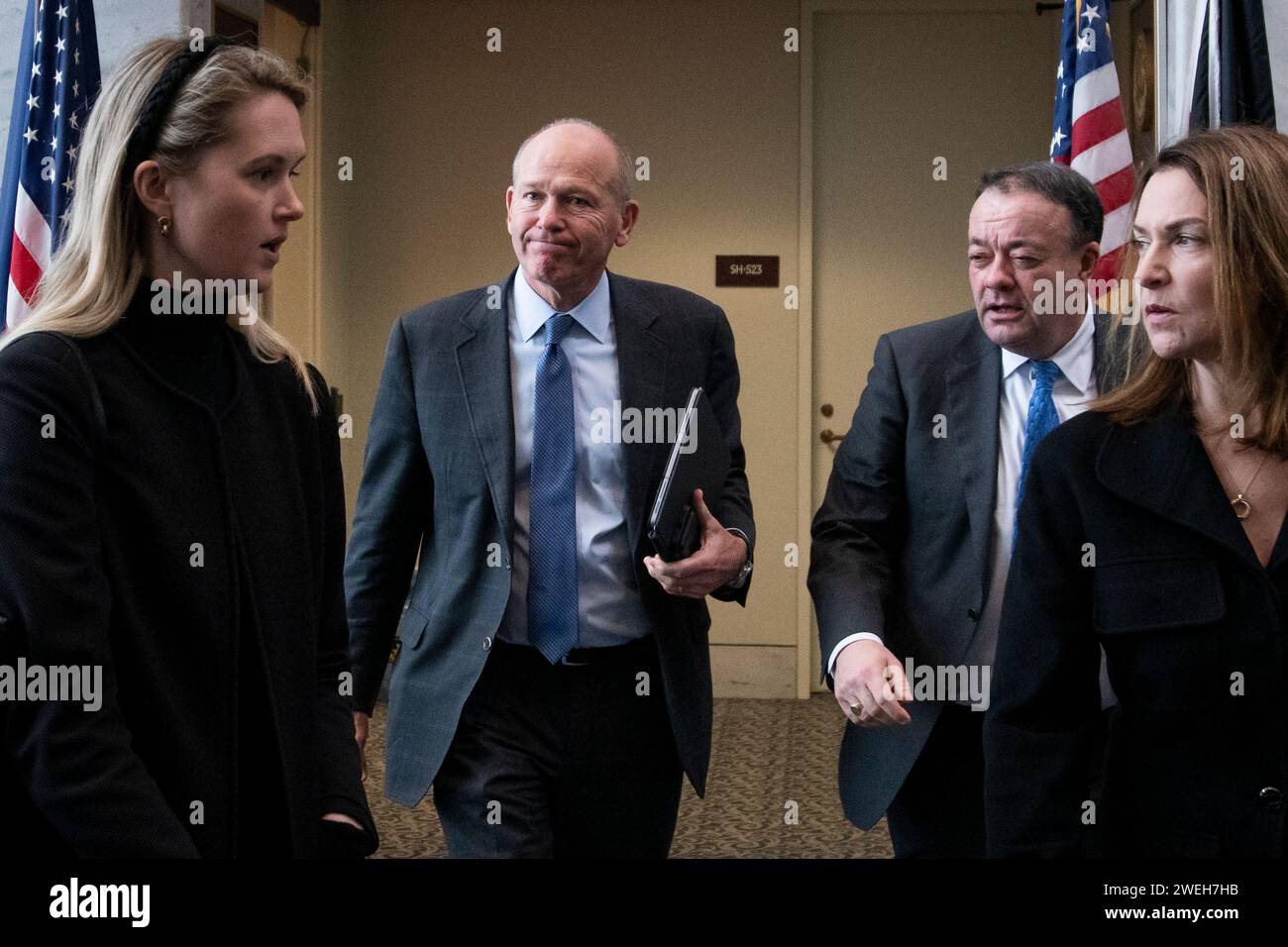 Boeing CEO Dave Calhoun, second from left, departs the office of United ...