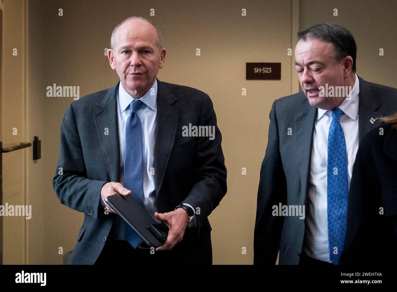 Boeing CEO Dave Calhoun, left, departs the office of United States ...
