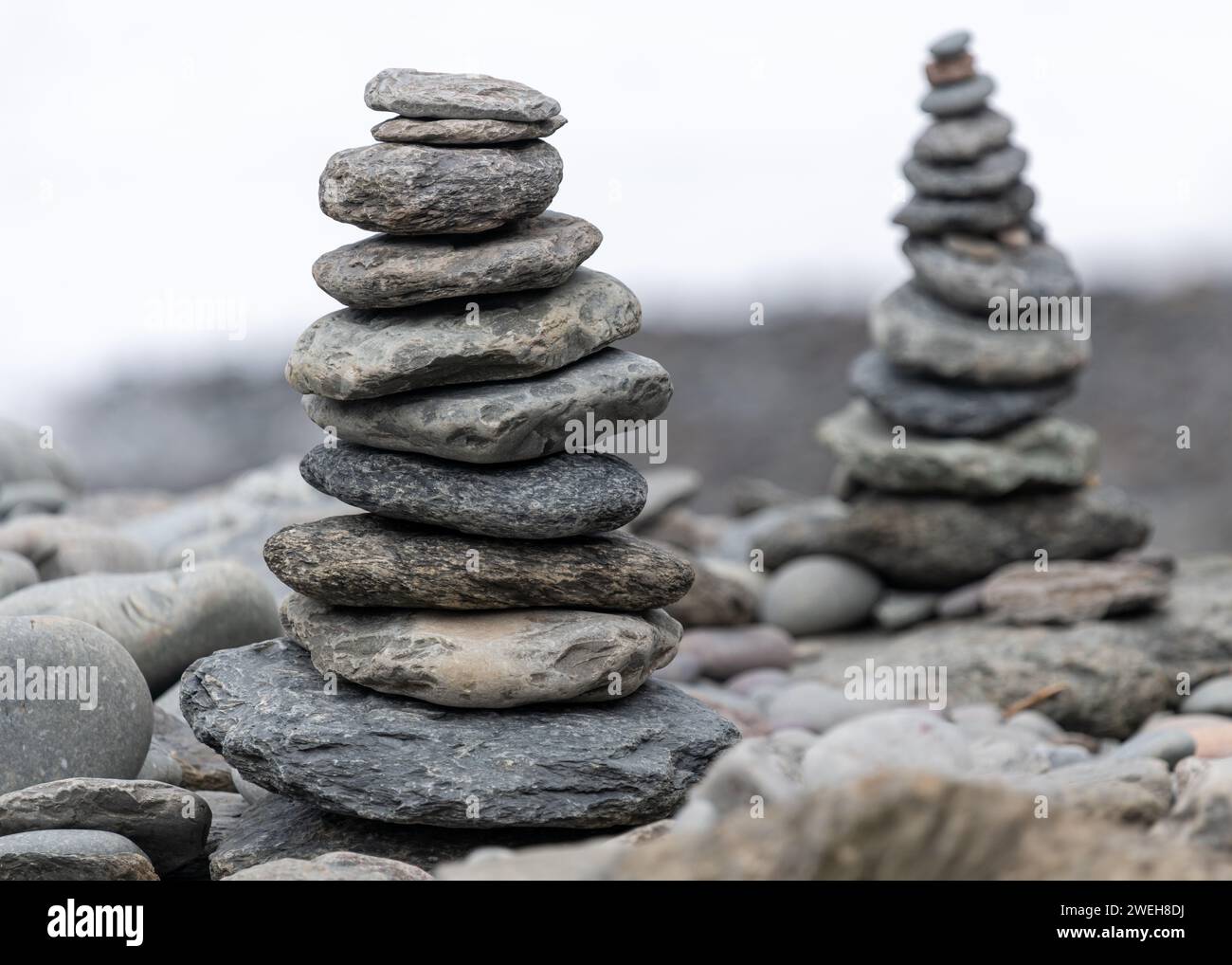 Close up of two towers of pebbles stacked up on a pebble beach Stock ...
