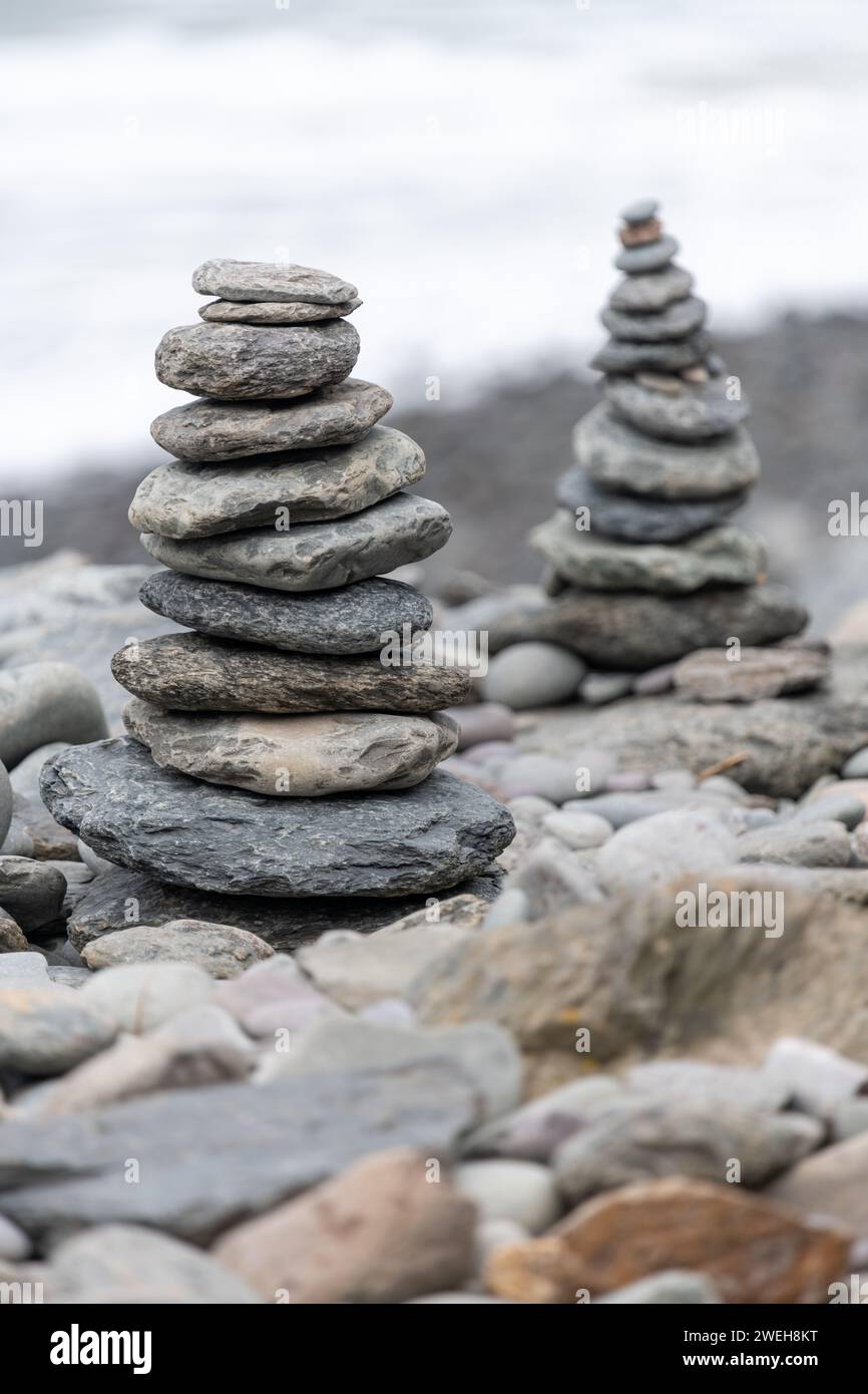 Close up of two towers of pebbles stacked up on a pebble beach Stock ...