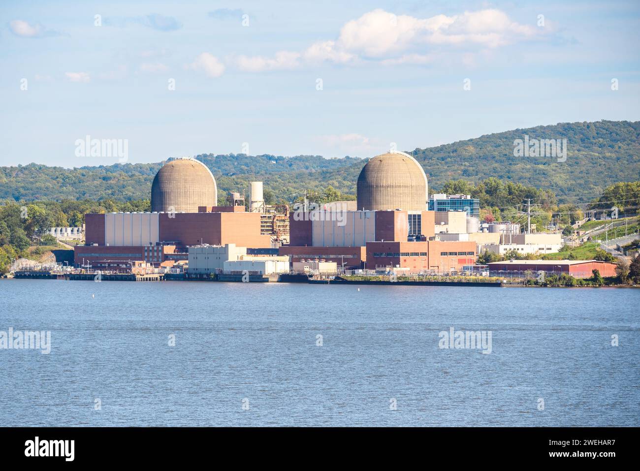 Nuclear power station on the bank of a mighty river on a sunny autumn ...