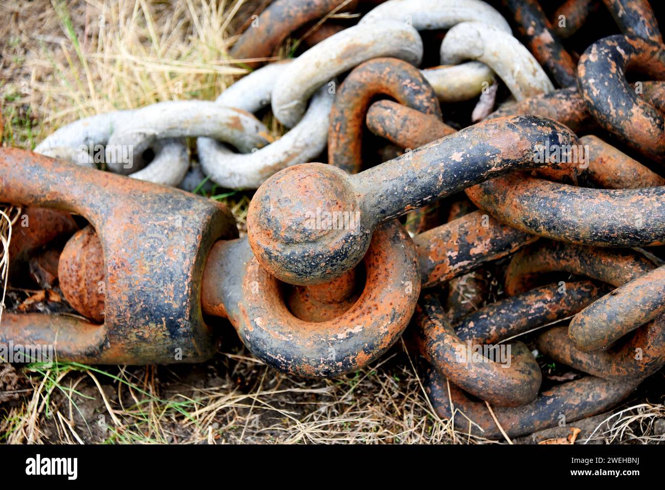 Old steel, ship chain lays in a heap near a dock in Astoria, Oregon ...