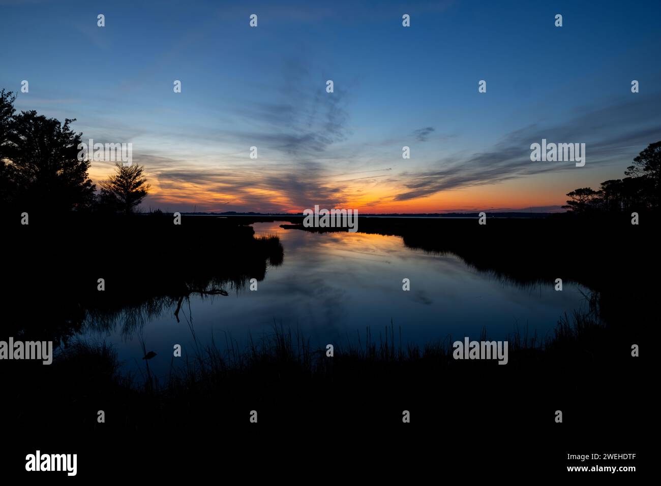 Sunset at a pond in Assateague Island National Seashore, Maryland Stock ...