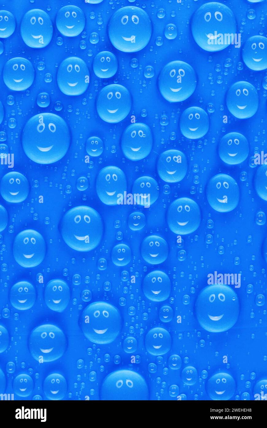 lots of funny little blue water drops on a blue surface, a smiley face ...