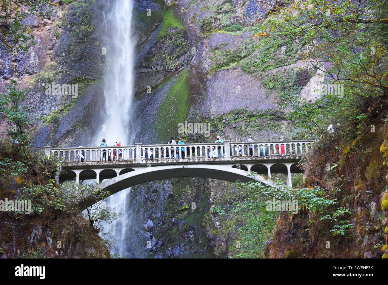 Visitors enjoy a closeup view of Multnomah Falls, in Oregon. A group ...