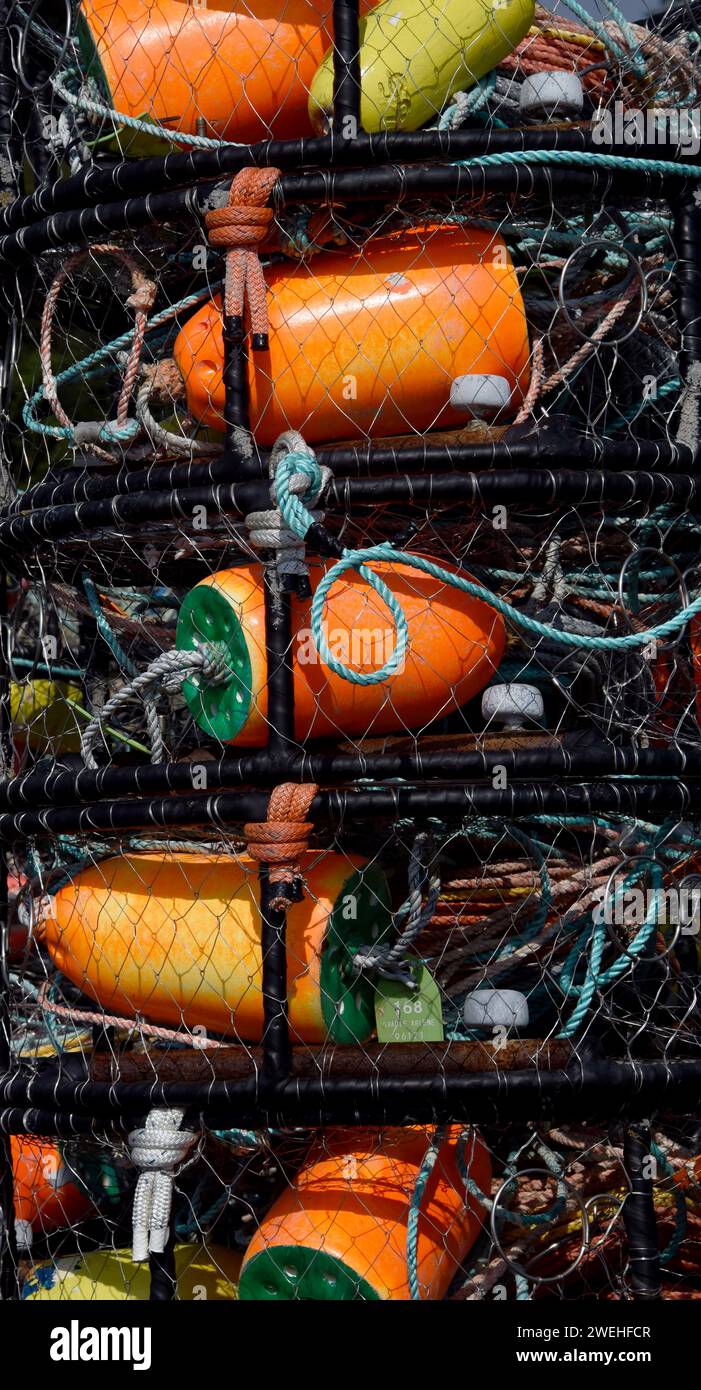 Lobster and crab pots are loaded with rope and bright orange floats ...