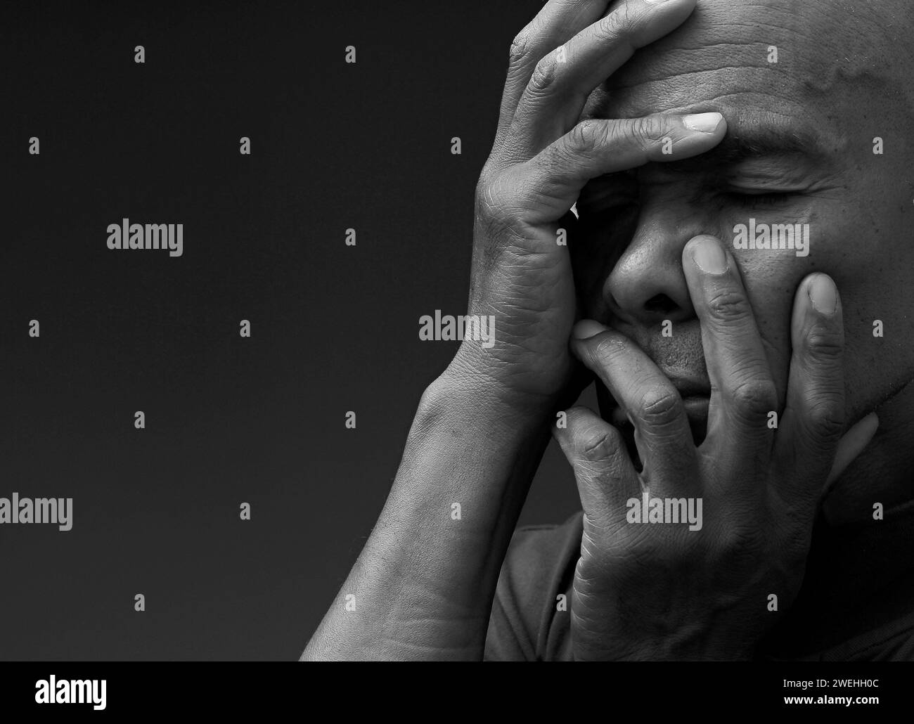 black man praying to god with hands together Caribbean man praying with ...