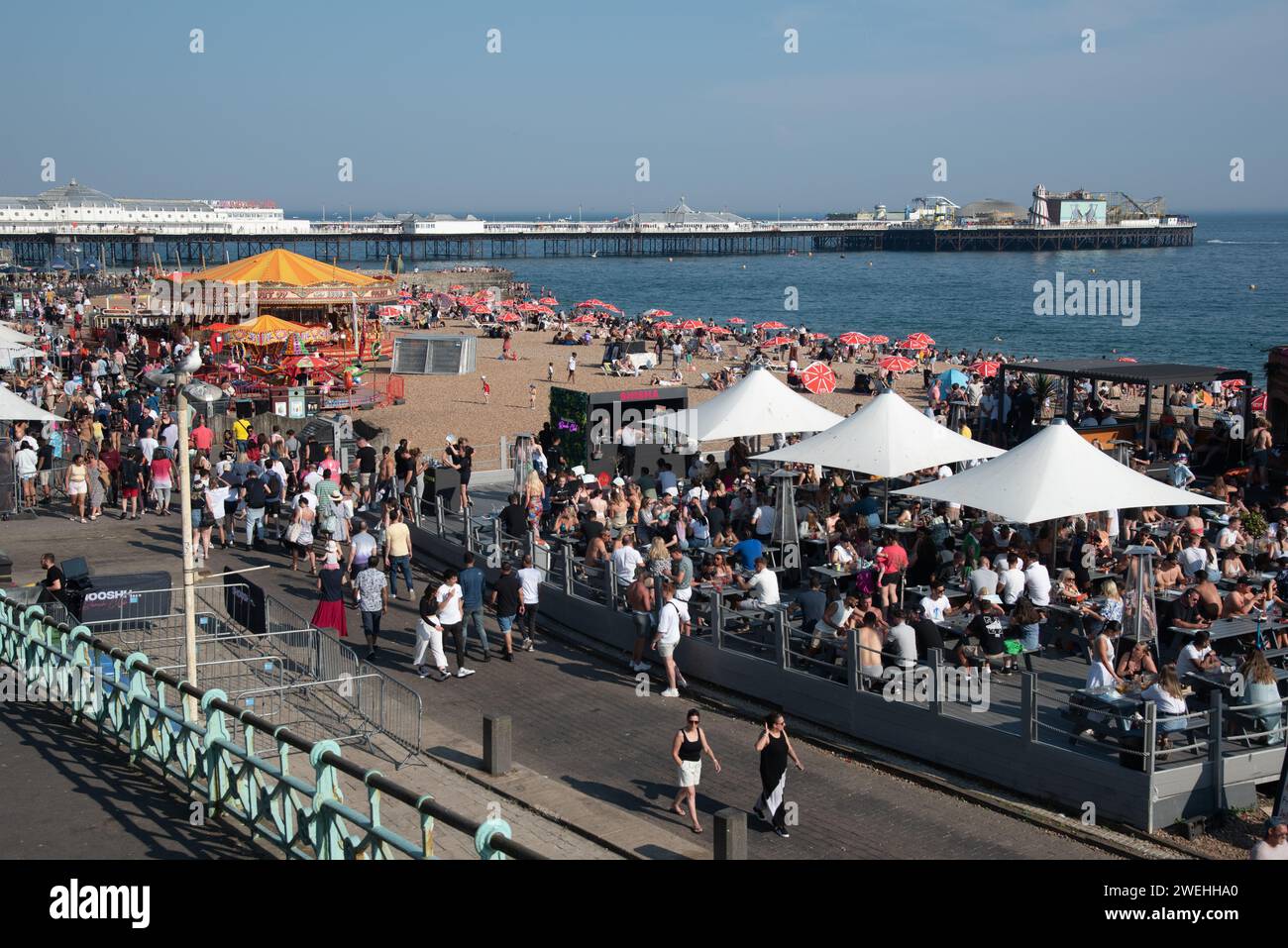 Crowd of british people walking and having fun at brighton town ...