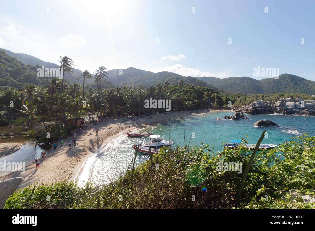 Famous Cabo San Juan beach with touristic boats and Sierra Nevada ...