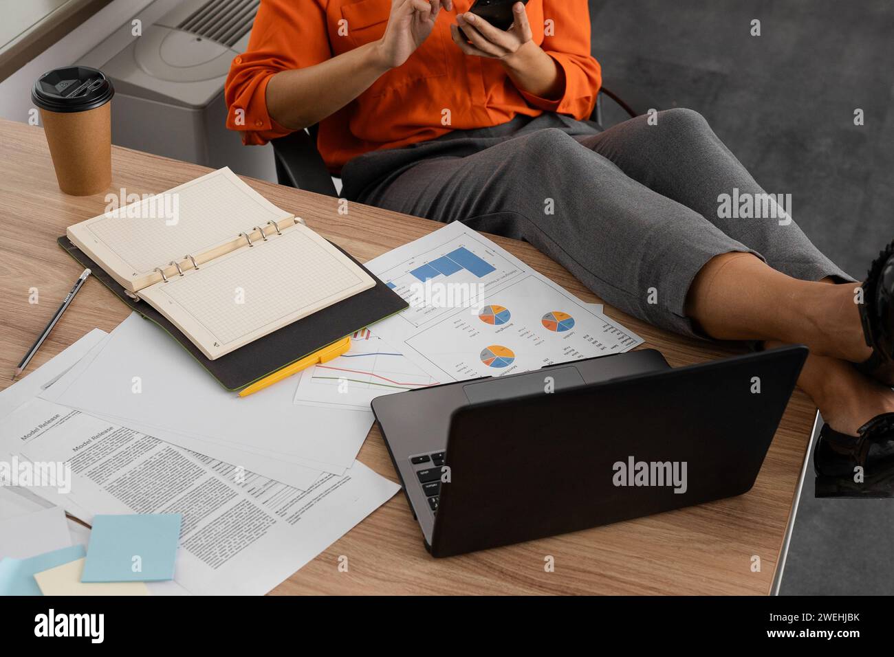 Young busy African business woman executive working on laptop making ...