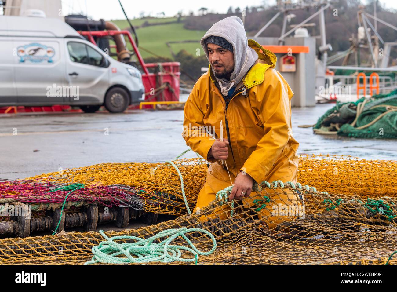 Fishermen mending nets in Union Hall, West Cork, Ireland Stock Photo ...