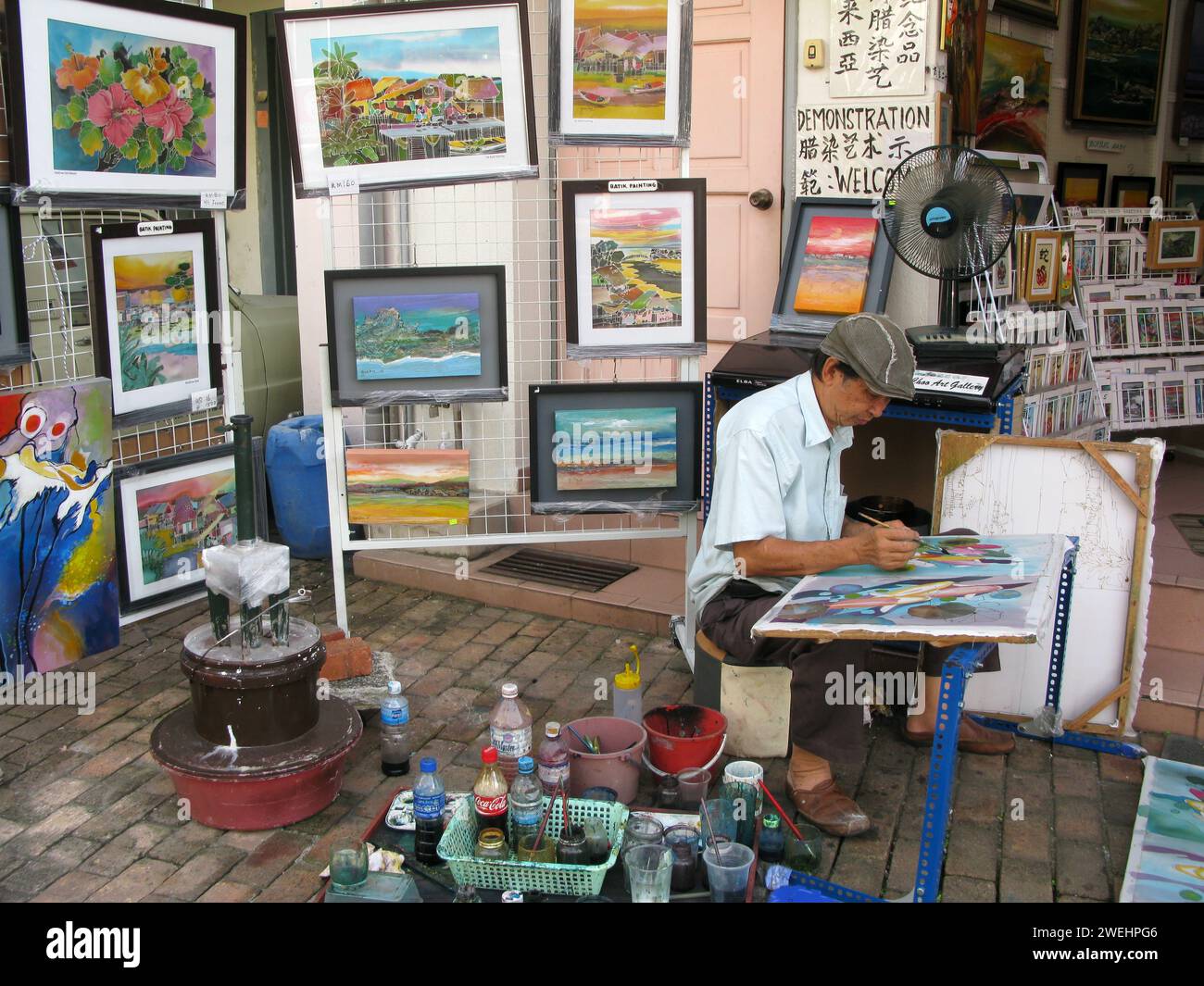 An artist at work in Melaka City in Malacca State in Malaysia Stock ...