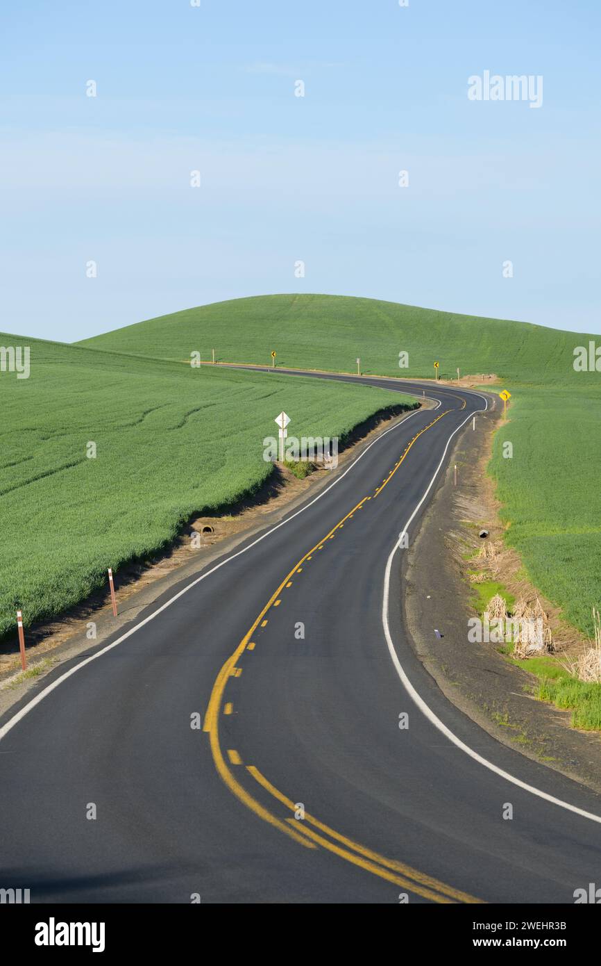 Paved two lane road sweeping through the rolling hills of the Palouse ...