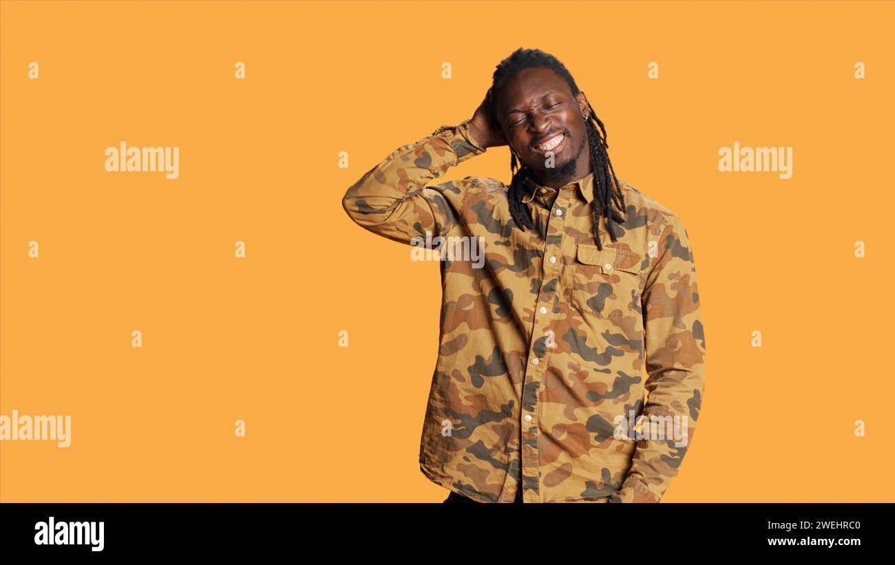 African american focused man acting confused and clueless, posing with ...