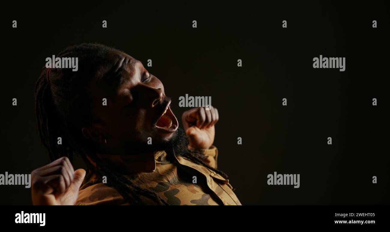 Lazy male model feeling sleepy on black background, experiencing ...