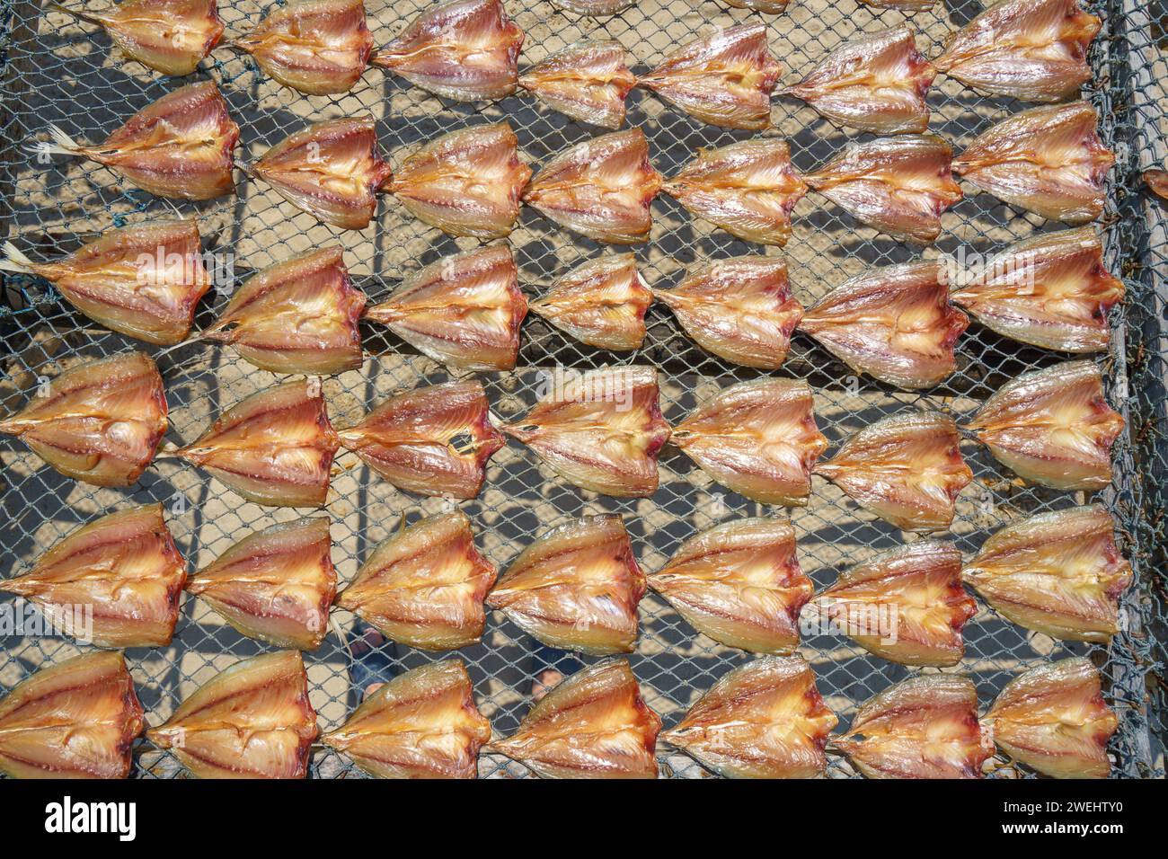 Sun-dried and deep-fried fish in a quaint fishing village brings to ...