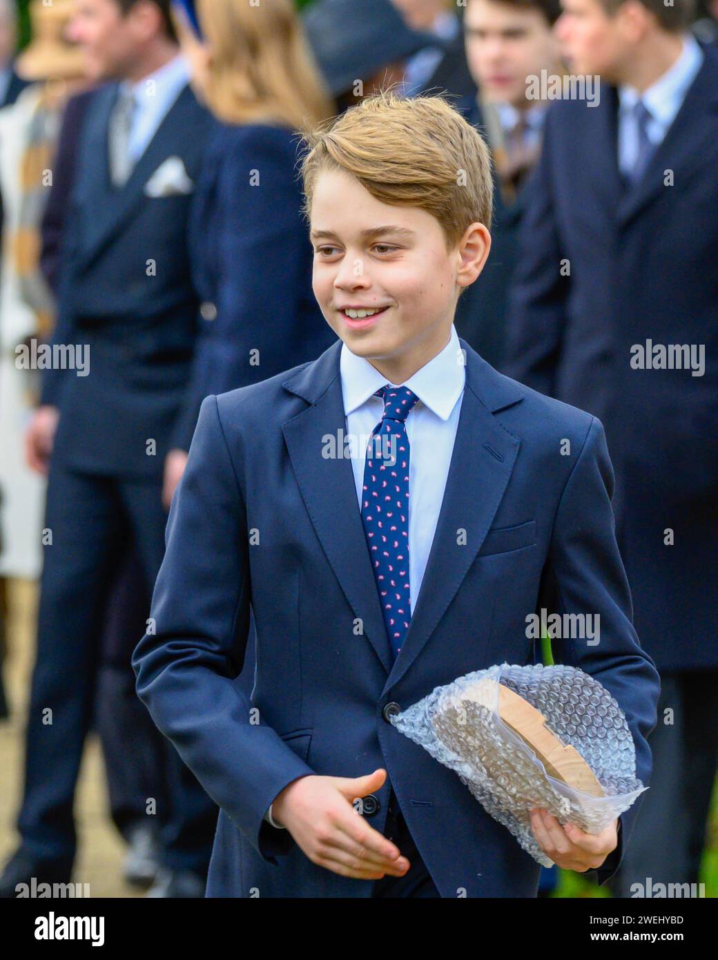 Prince George greets well-wishers after attending the Christmas service ...