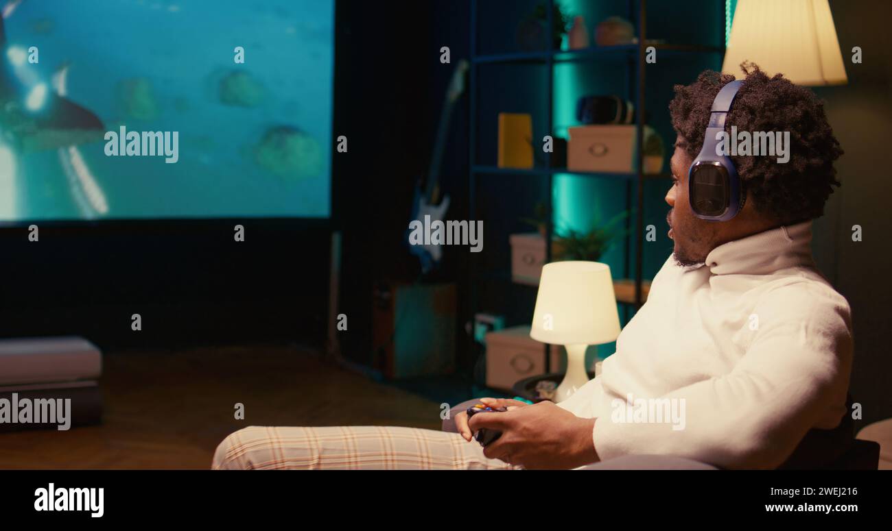 Man plays SF singleplayer game with overlay HUD showing health bars and ...