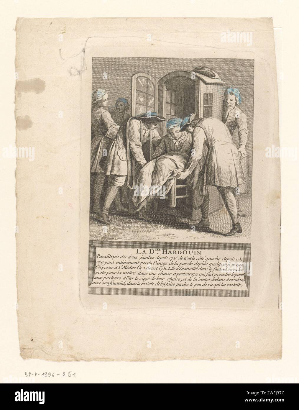 Mrs. Hardouin, paralyzed on her legs, is lifted out of a carrying ...