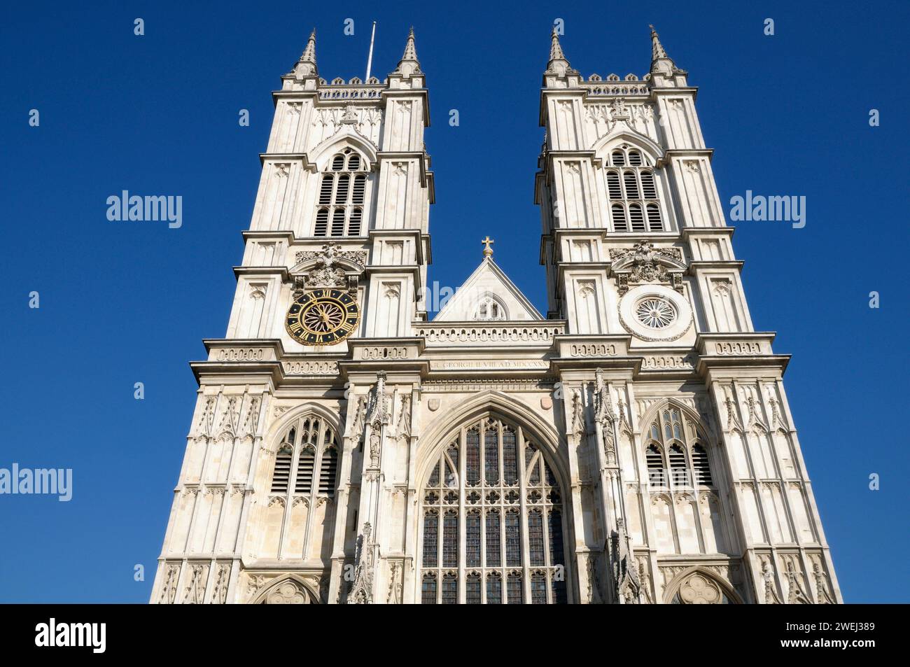 Gothic style architecture stonework of western facade bell towers above ...
