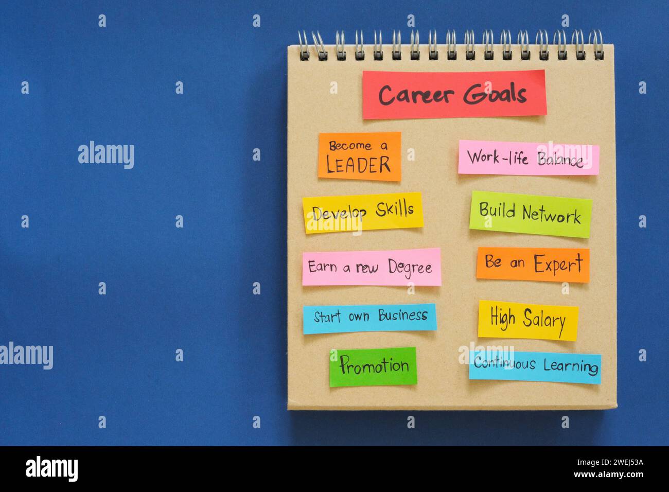 Career goals concept. Checklist of goals in note pad in blue background ...