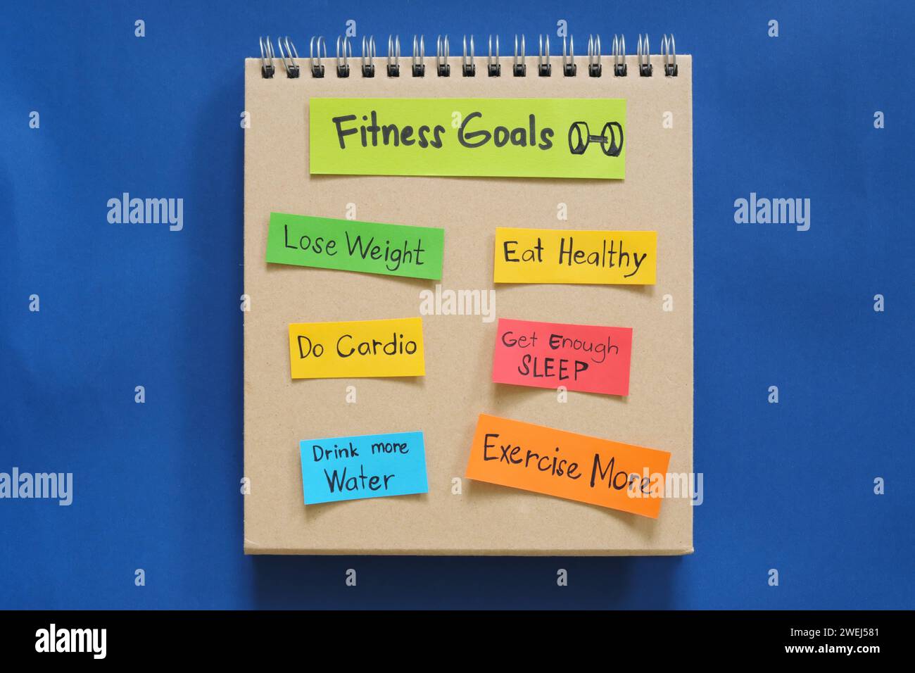 Fitness goals concept. Checklist of goals in note pad in blue ...