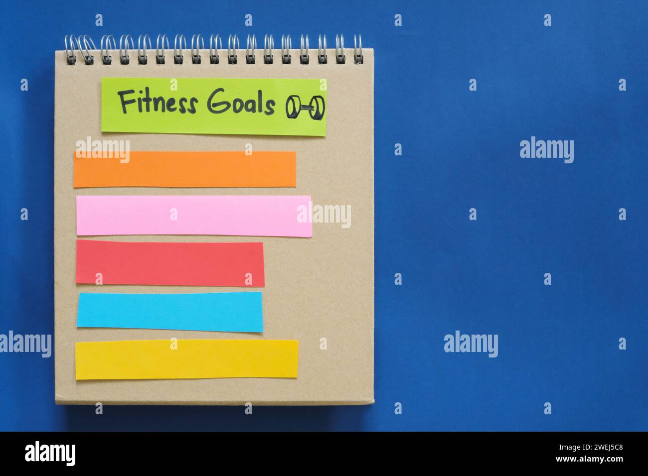 Fitness goals concept. Checklist of goals in note pad in blue ...