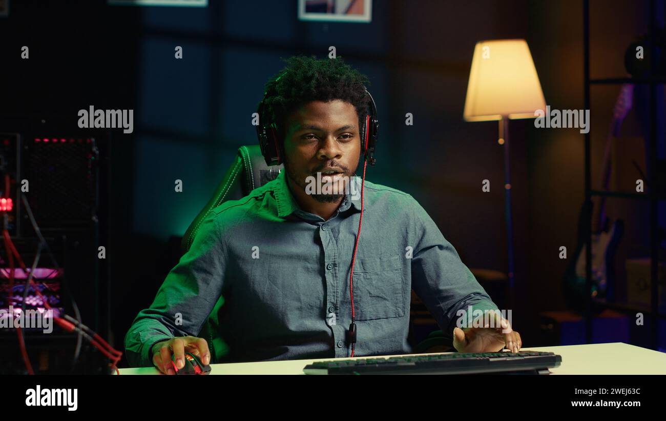 Sad gamer removing headphones in frustration, raging after game over ...