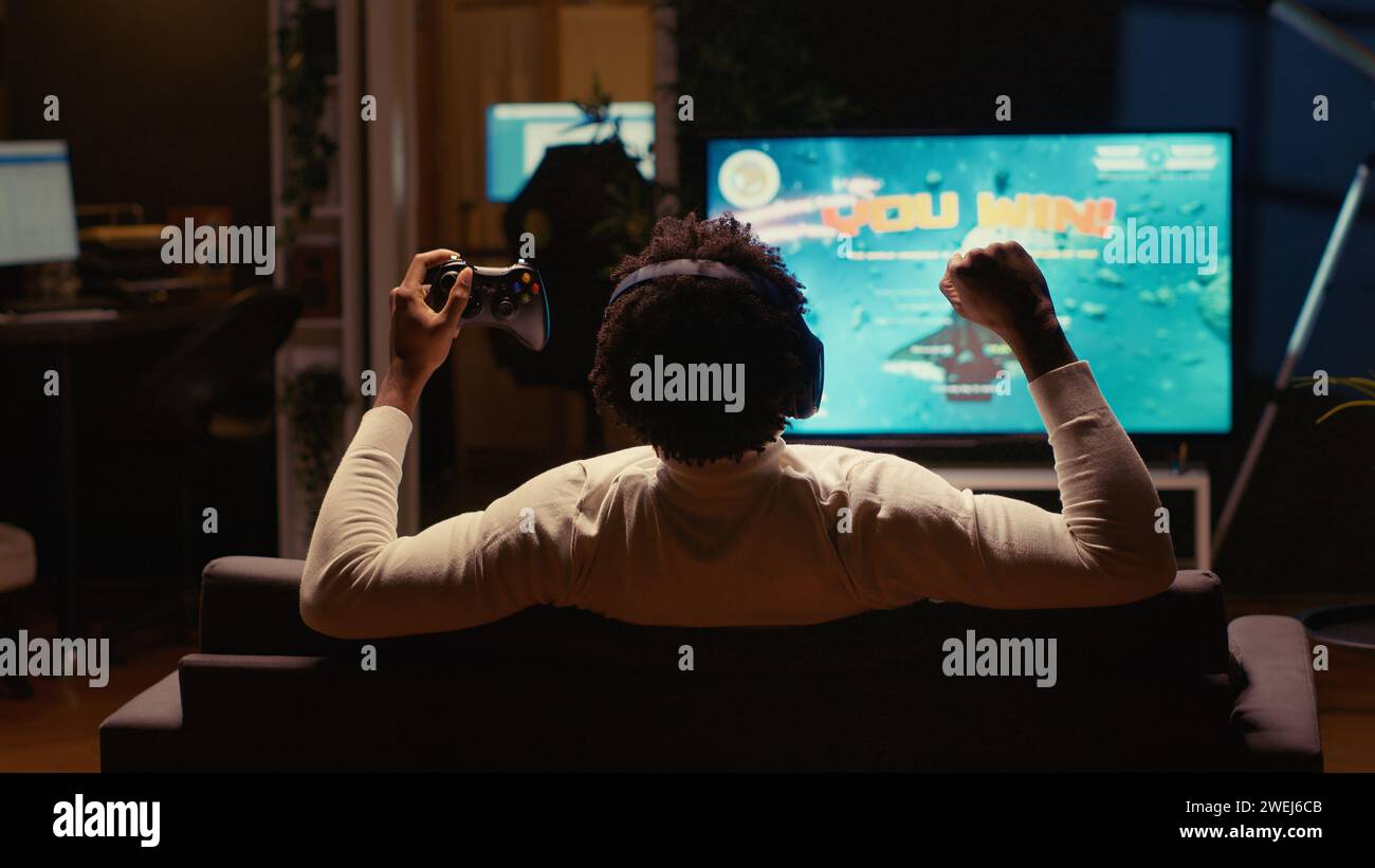 BIPOC man happy after winning SF game, destroying all enemy spacecrafts ...