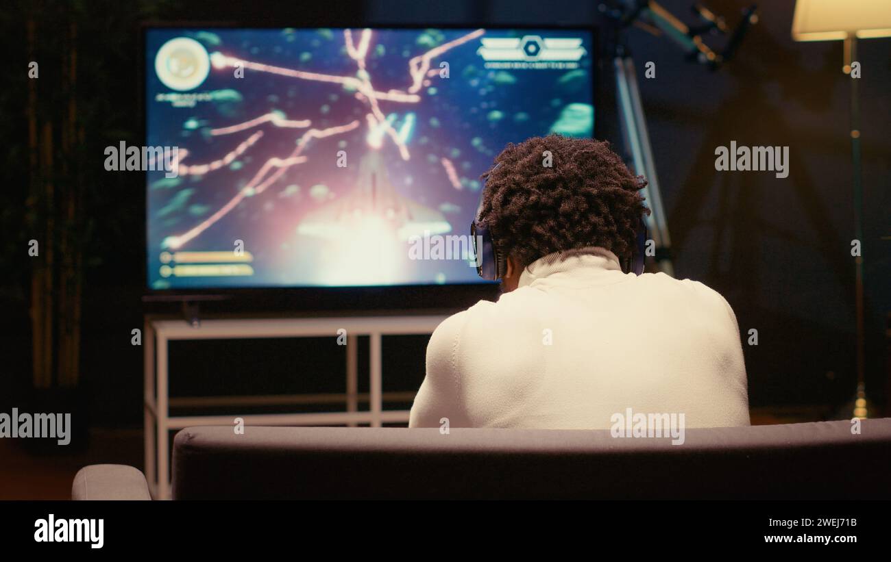 Gamer receiving game over screen on television set, getting his ...