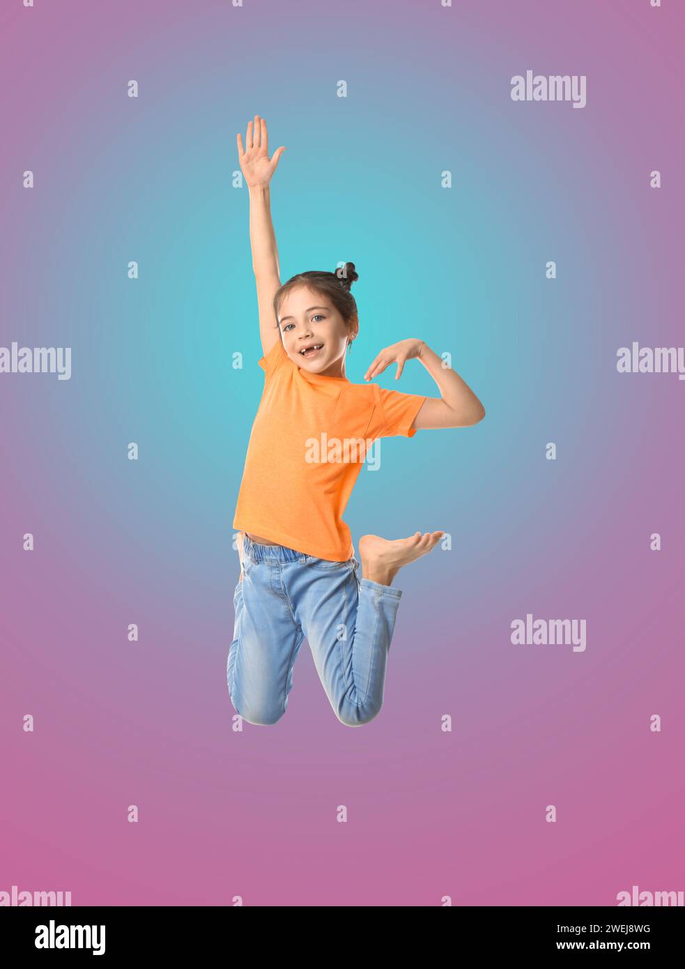 Happy cute girl jumping on color gradient background Stock Photo - Alamy