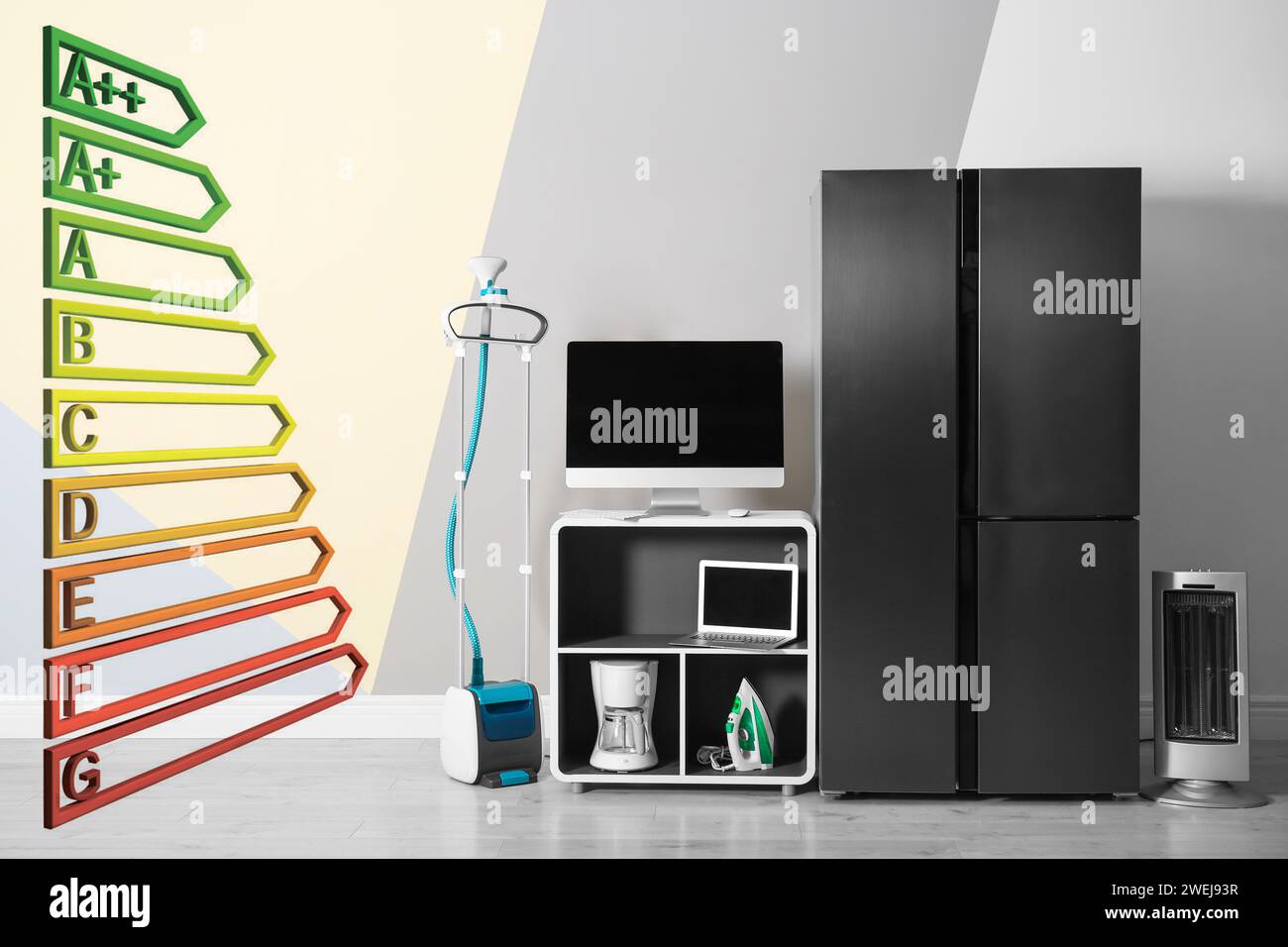 Energy efficiency rating label and different household appliances near ...