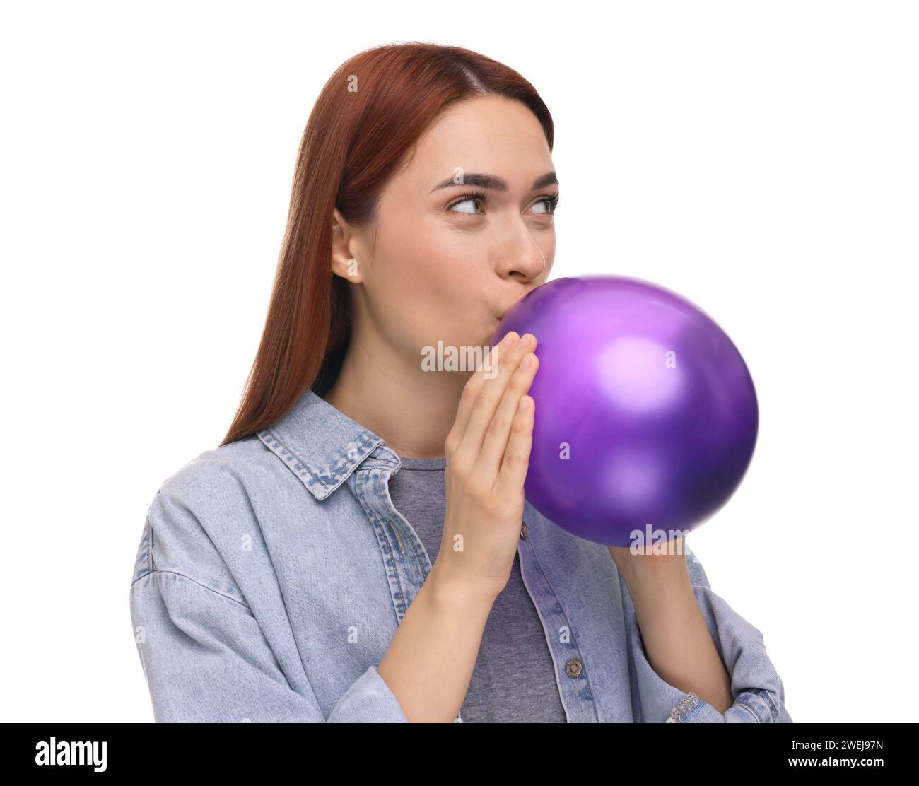 Woman inflating purple balloon on white background Stock Photo - Alamy