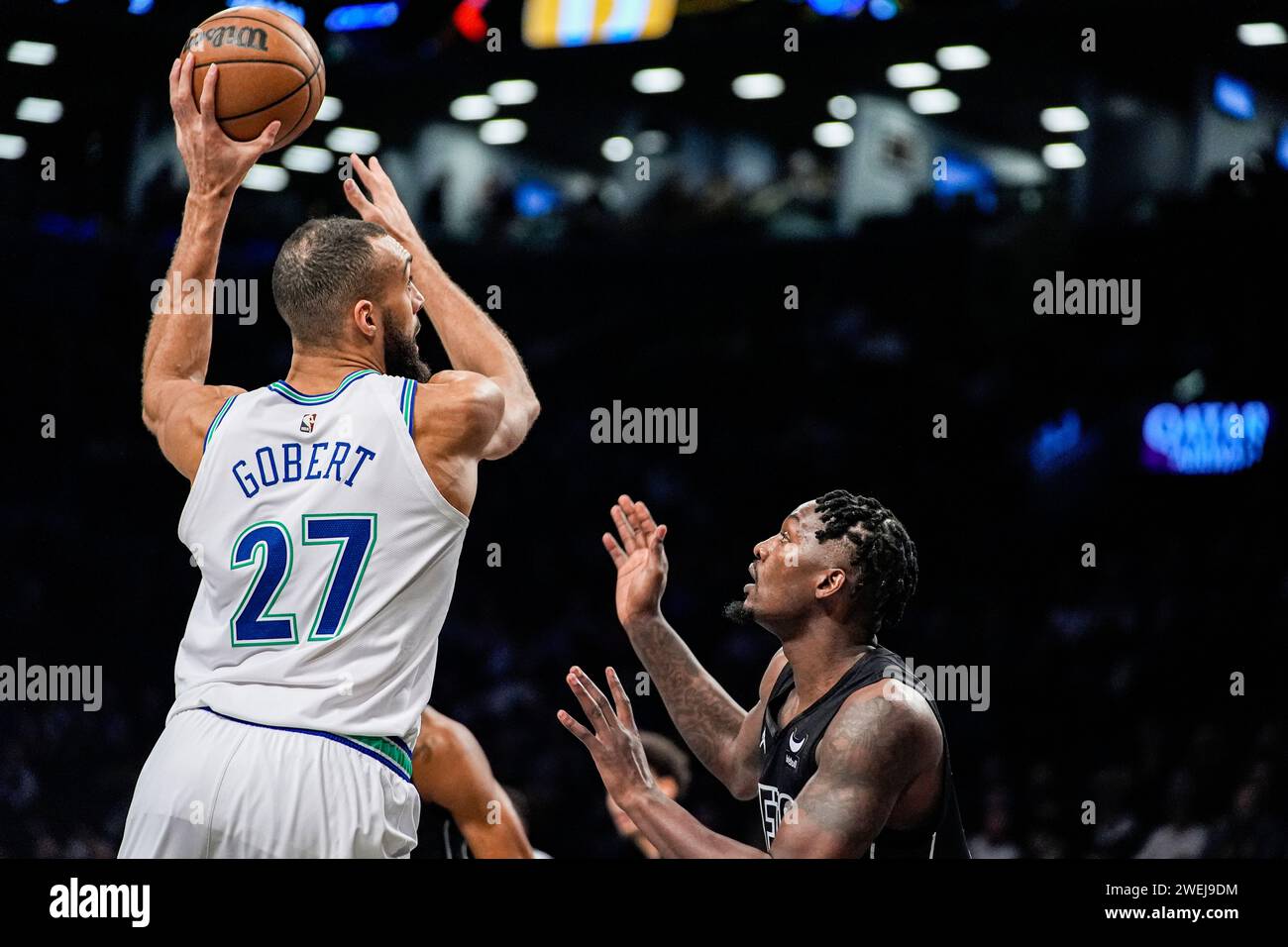 Minnesota Timberwolves center Rudy Gobert, left, shoots over Brooklyn ...